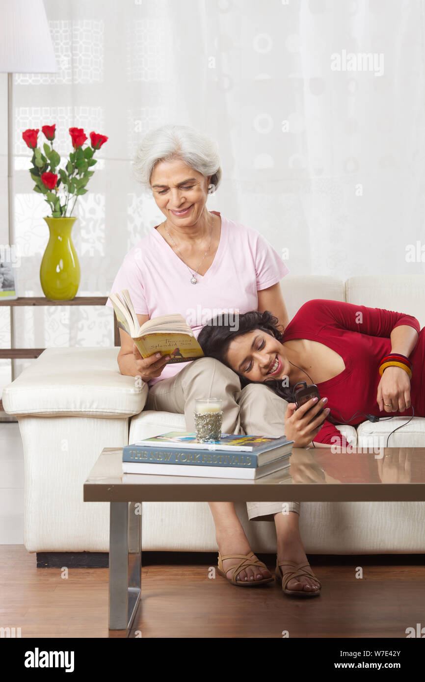 Old woman with a book hi-res stock photography and images - Alamy