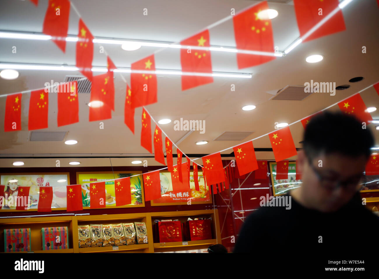 A tourist shops in a store on the Nanjing Road pedestrian shopping ...