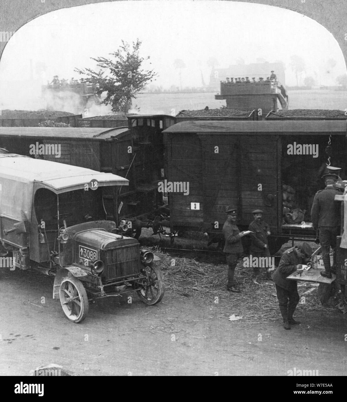 Troops and supplies are rushed from a railhead to the firing line ...