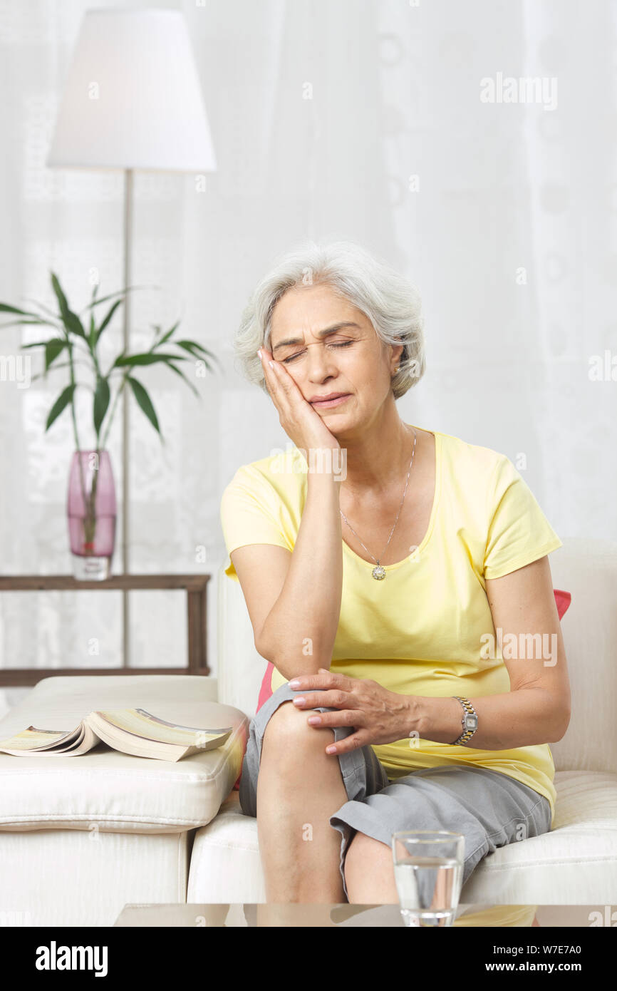 Old woman suffering from tooth pain Stock Photo - Alamy