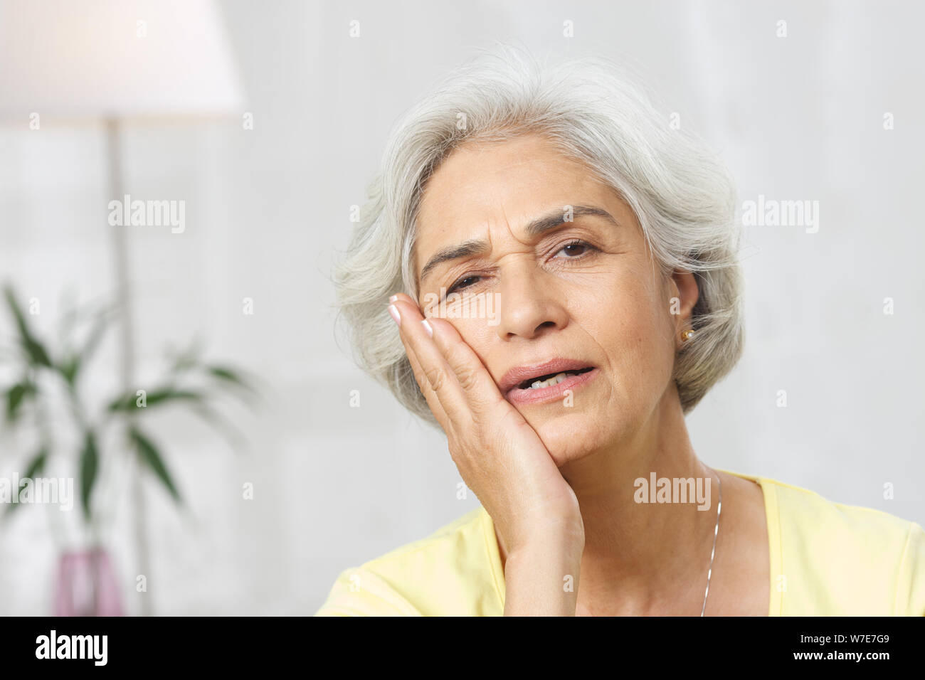 Old woman suffering from tooth pain Stock Photo - Alamy
