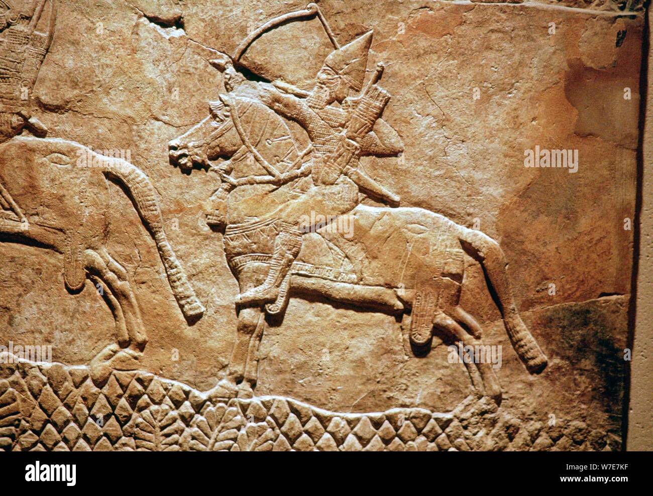 Relief of an Assyrian archer on horseback. Artist: Unknown Stock Photo ...