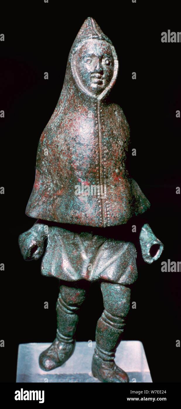 Roman bronze figure of a man wearing a cloak, 4th century. Artist ...