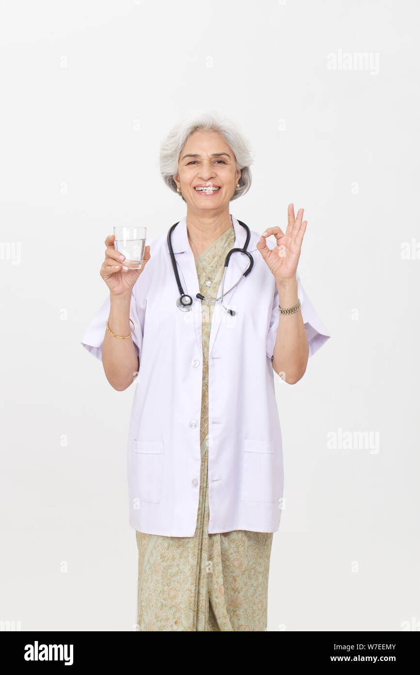 Female doctor drinking water hi-res stock photography and images - Alamy