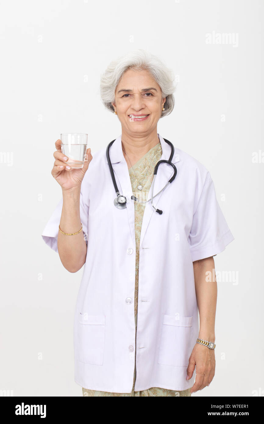 Female doctor drinking water hi-res stock photography and images - Alamy
