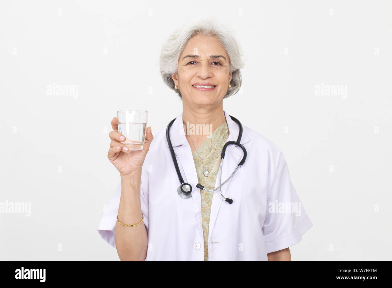 Female doctor drinking water hi-res stock photography and images - Alamy