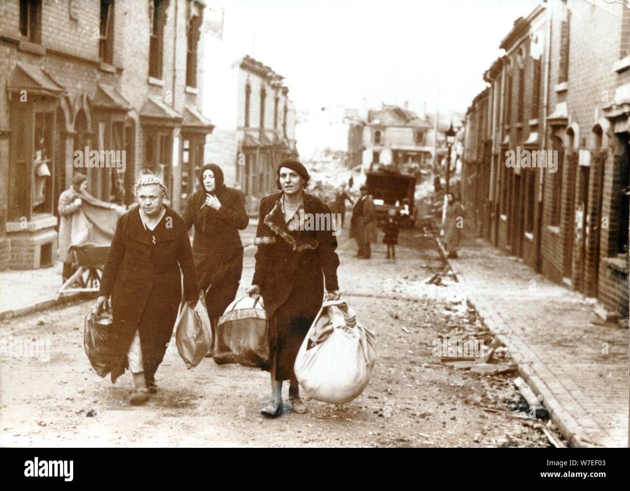 Women collect their belongings from bombed houses, London, World War II ...