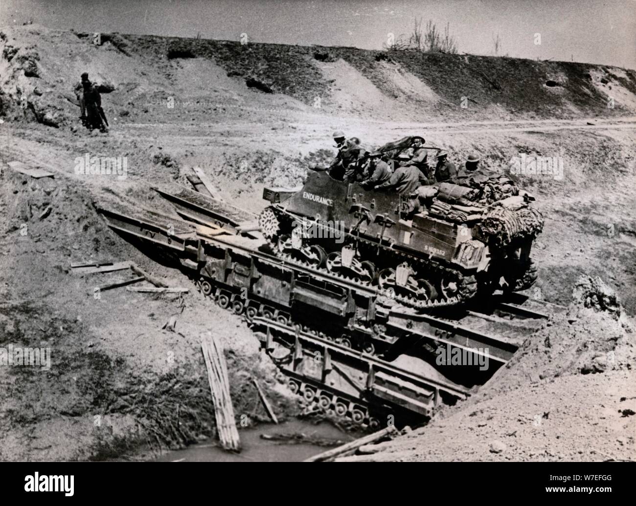 A Sexton SP gun crossing the Senio River, Italy, April 1945. Artist ...