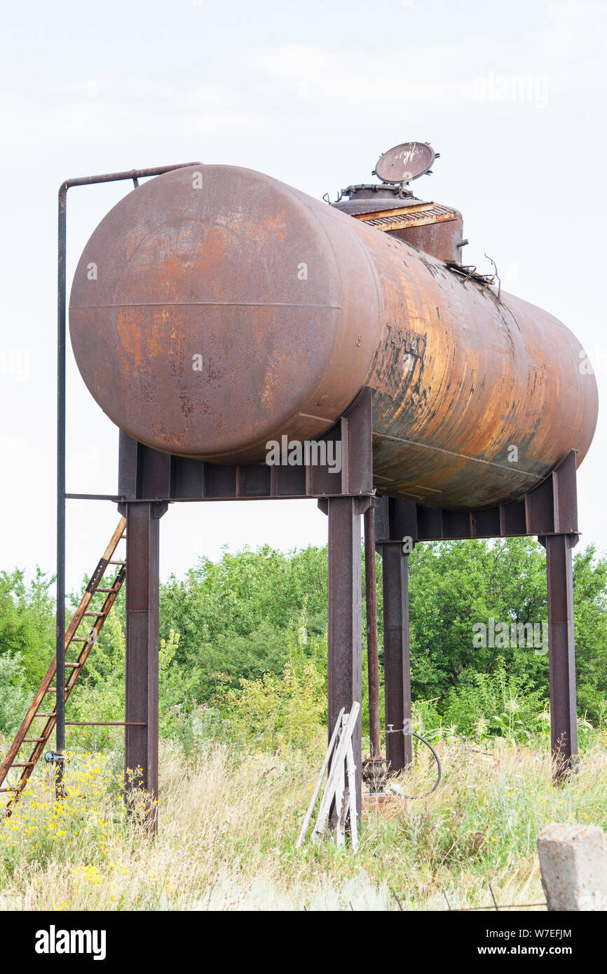 Old water tower, water in the village, rusty construction, vintage ...