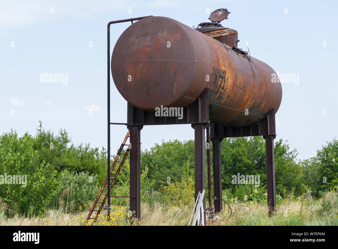 Old water tower, water in the village, rusty construction, vintage ...