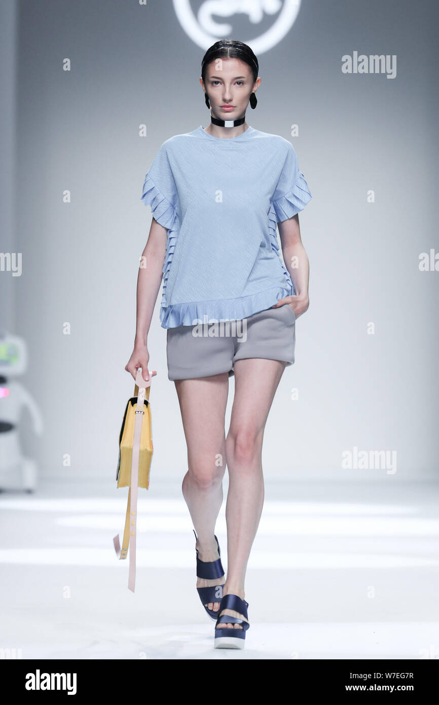 A model displays a new creation at the fashion show of AUSTIN.W. x ...