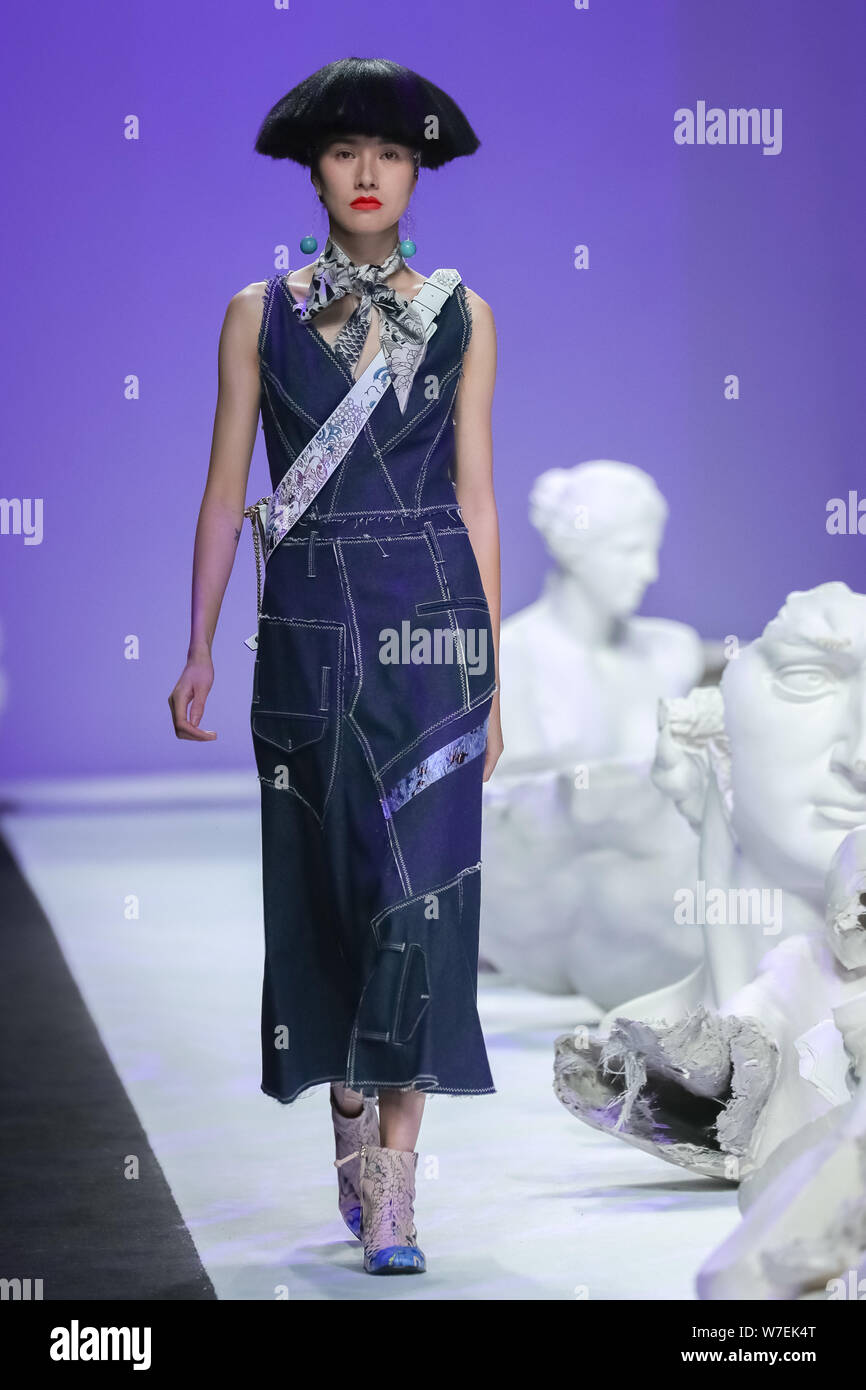 A model displays a new creation at the fashion show of JI CHENG during ...