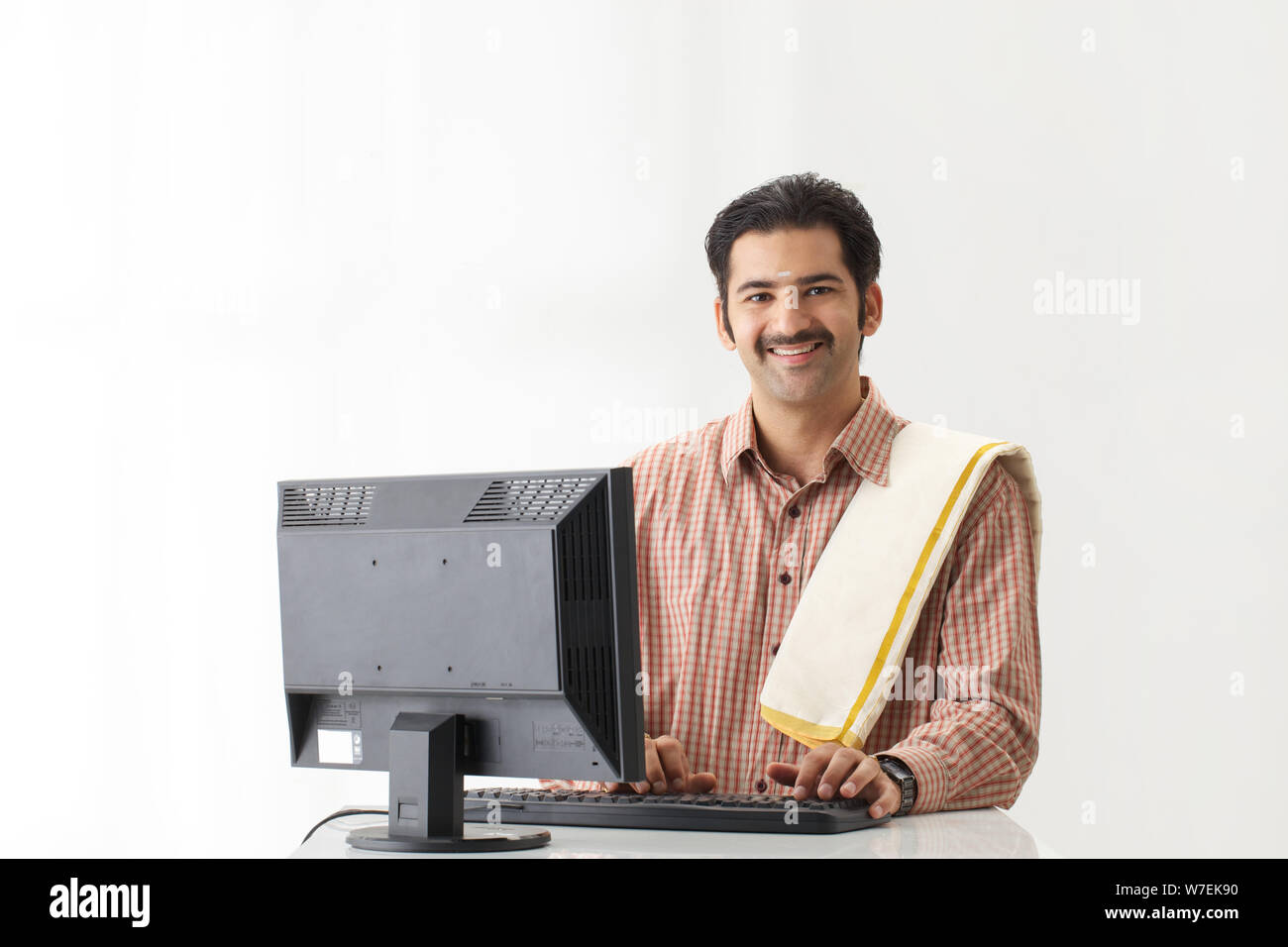 South Indian man working on a desktop pc Stock Photo - Alamy