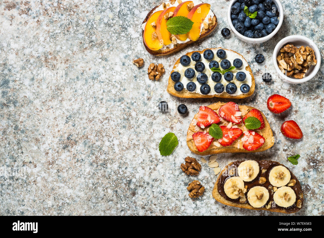 Sweet toast assortment with fresh fruit and berries Stock Photo - Alamy