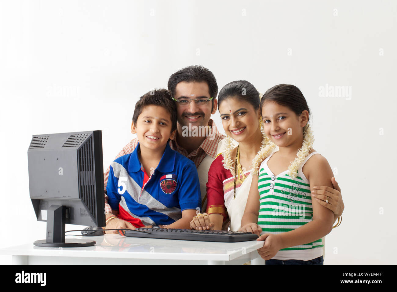 A family with a desktop computer hi-res stock photography and images ...