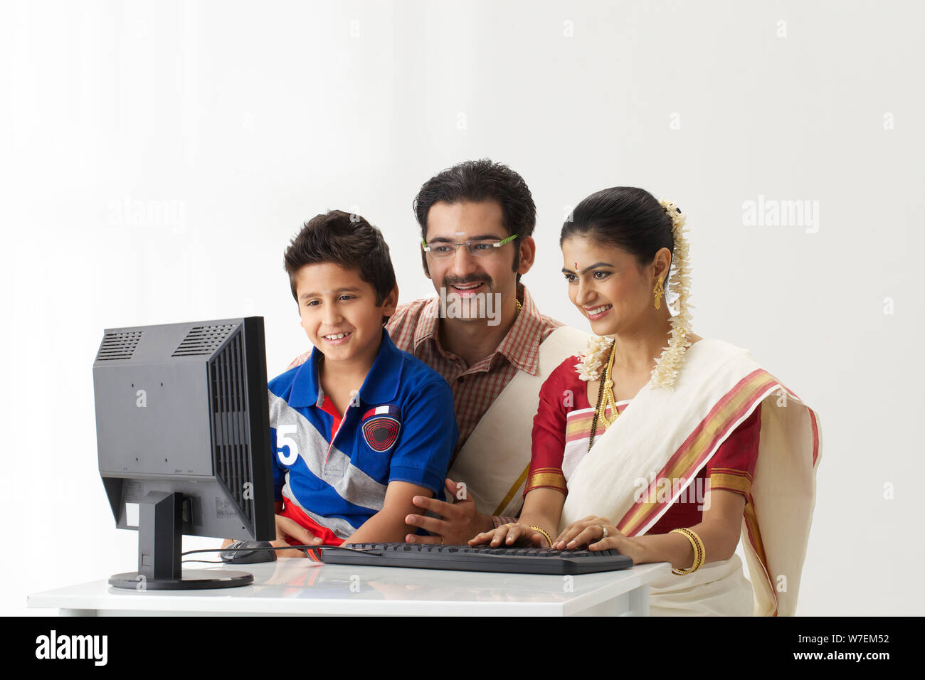 South Indian family using desktop pc Stock Photo - Alamy
