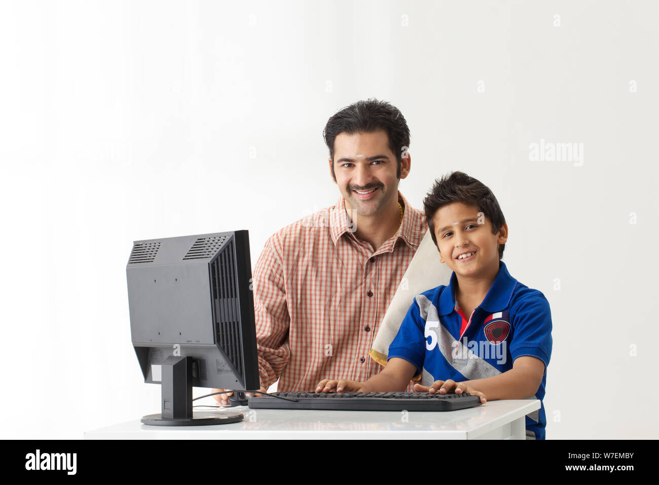 Child using desktop computer at home hi-res stock photography and ...