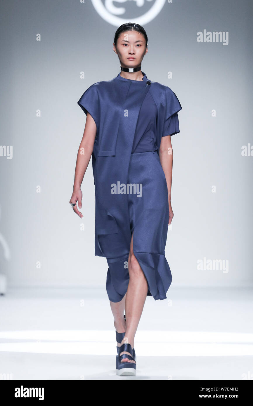 A model displays a new creation at the fashion show of AUSTIN.W. x ...