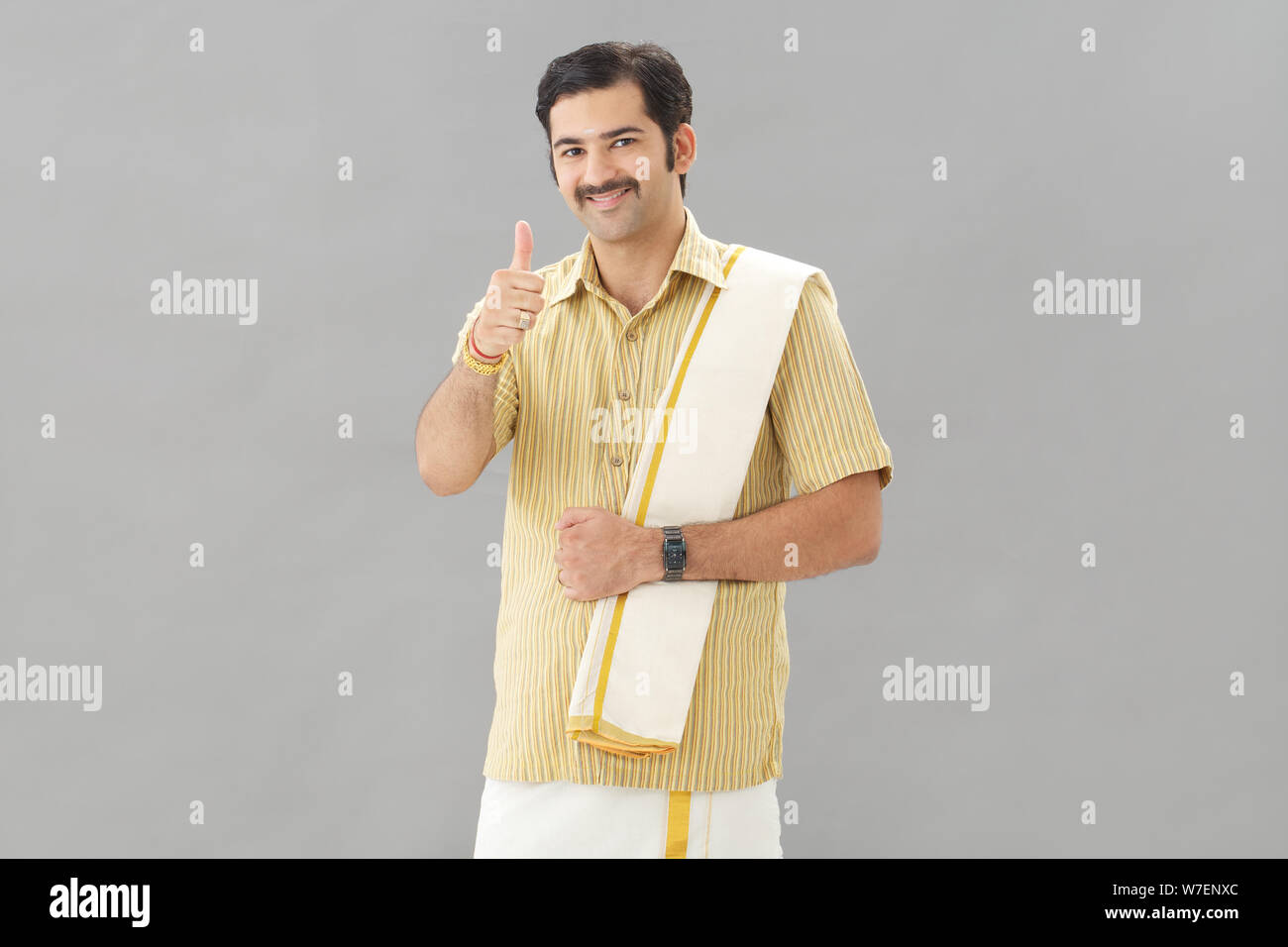 South Indian man showing thumbs up sign Stock Photo - Alamy