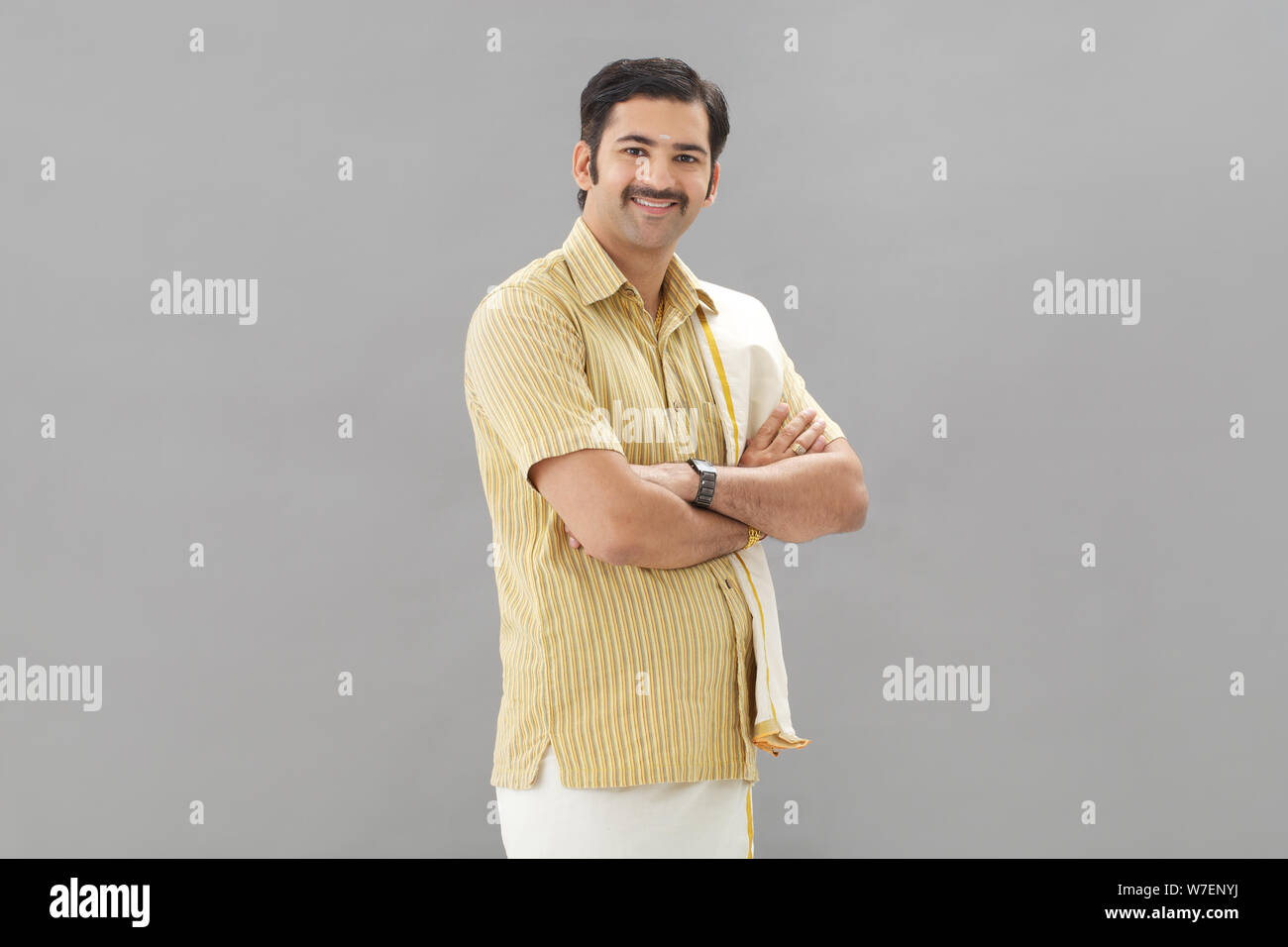 South indian man standing arms hi-res stock photography and images - Alamy