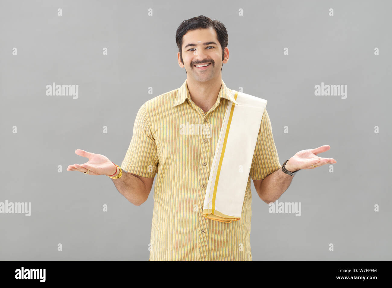 South Indian man smiling with his arms outstretched Stock Photo - Alamy