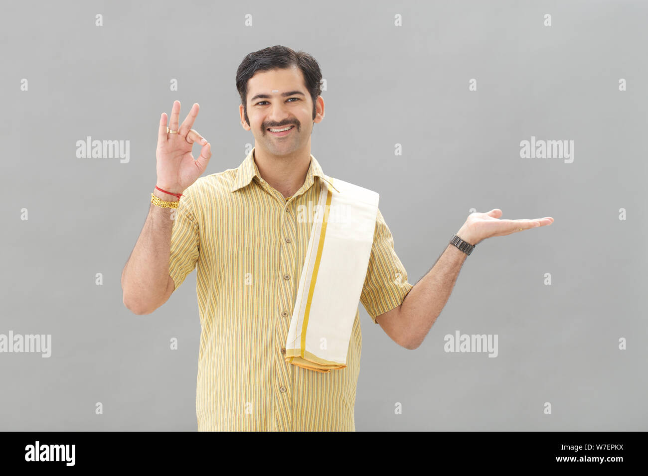 Indian man looking at sign hi-res stock photography and images - Alamy