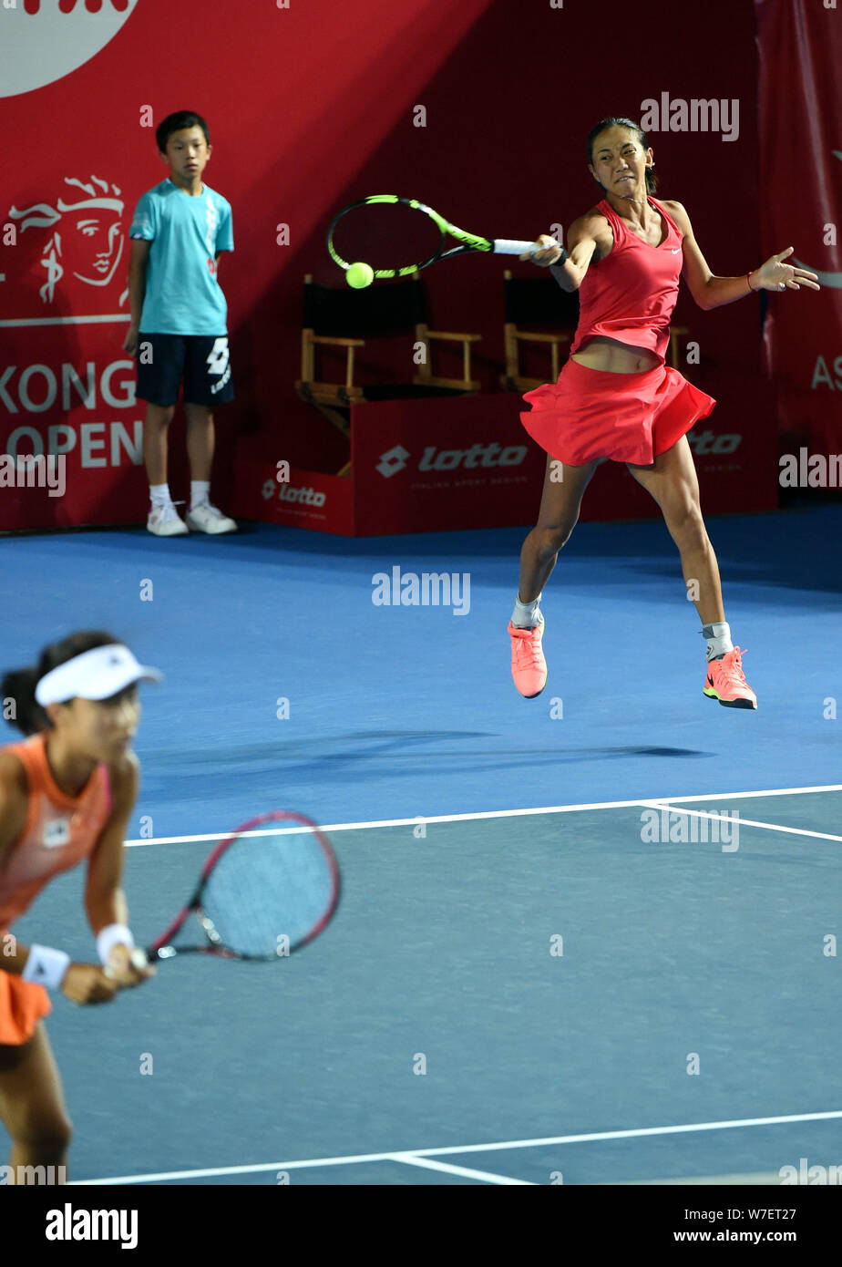 Lu Jiajing, right, returns a shot as she and Wang Qiang of China ...