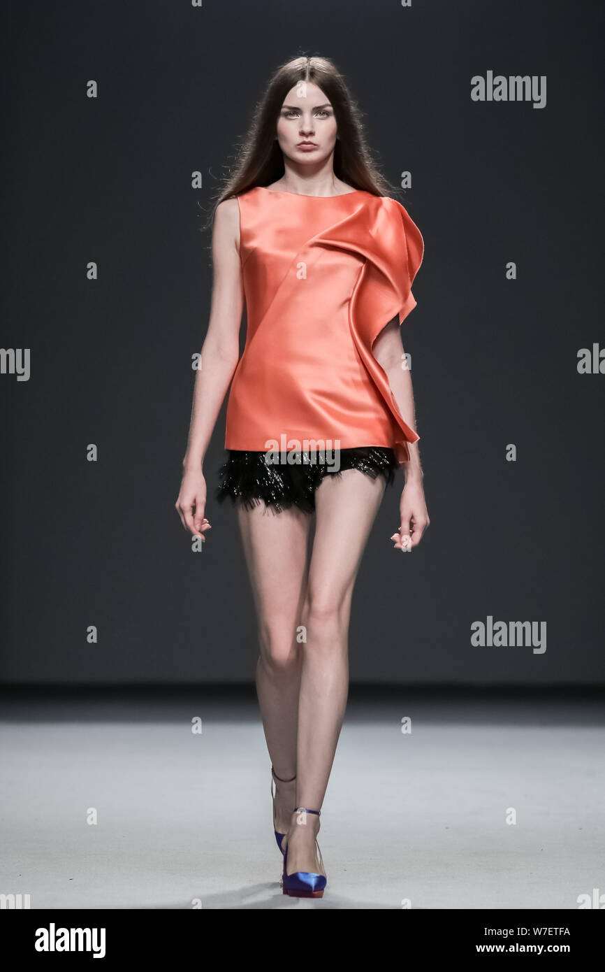 A model displays a new creation at the fashion show of We Couture ...