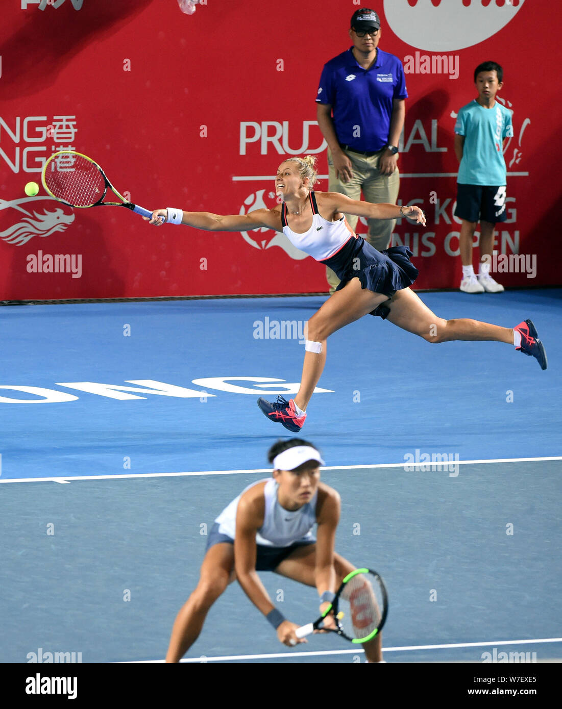Monique Adamczak of Australia, back, returns a shot as she and Chang ...