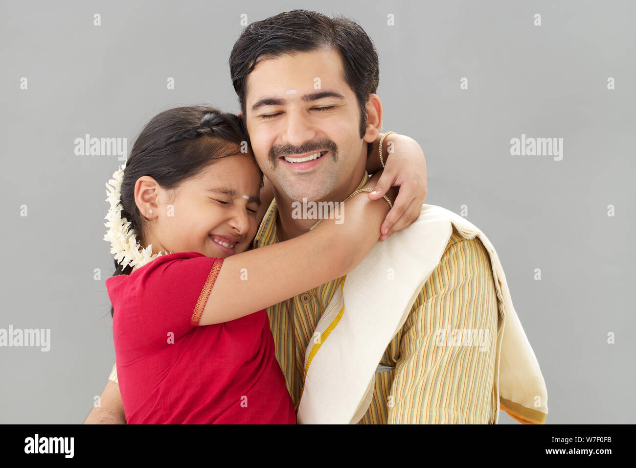 Girl hugging her father Stock Photo - Alamy