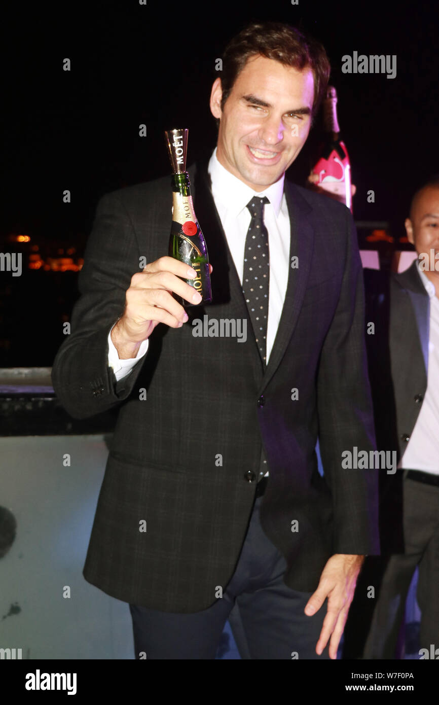 Swiss tennis player Roger Federer poses at the Moet and Chandon Party ...