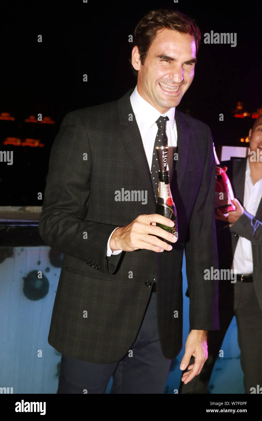 Swiss tennis player Roger Federer poses at the Moet and Chandon Party ...