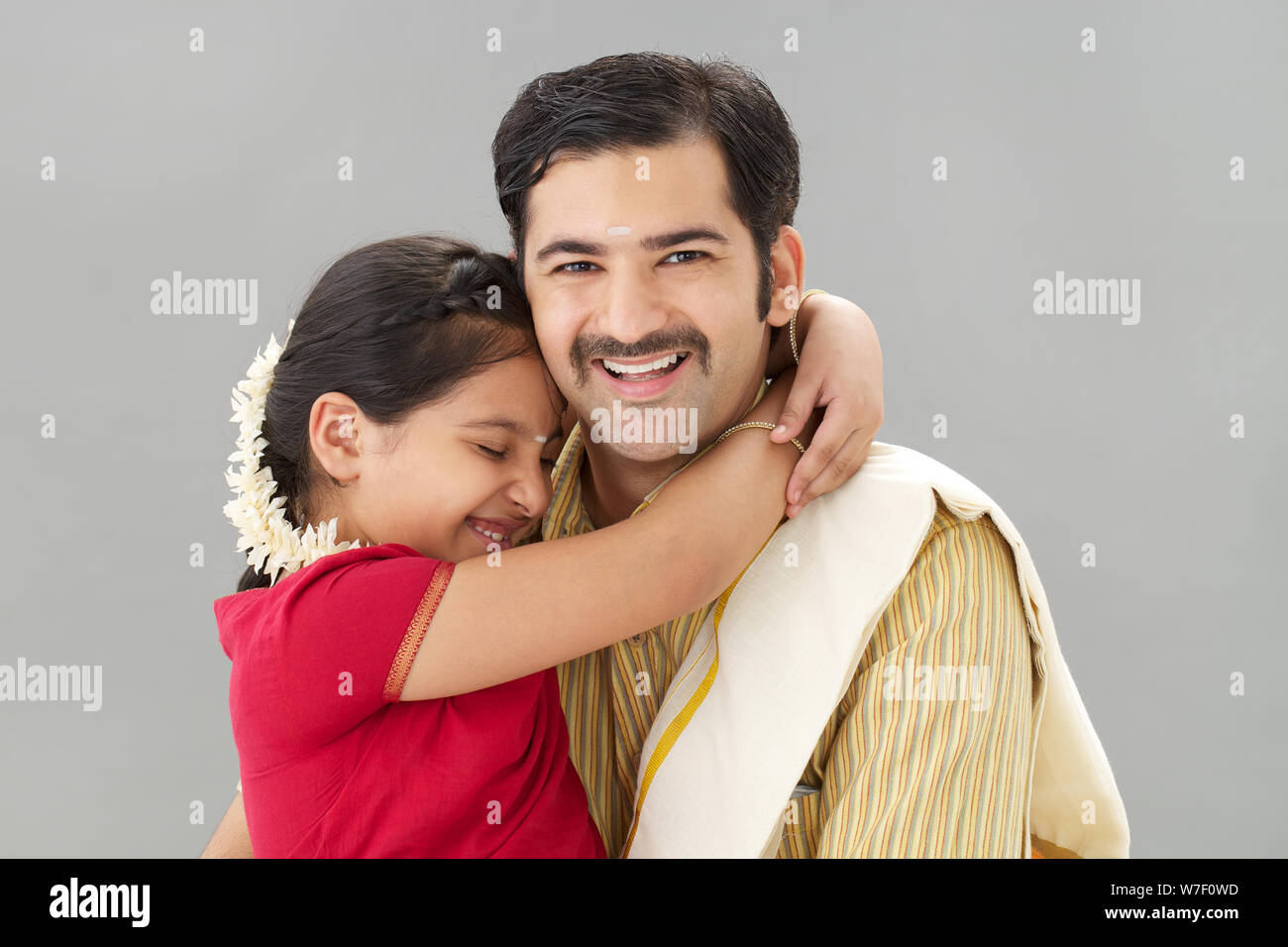 Girl hugging her father Stock Photo - Alamy