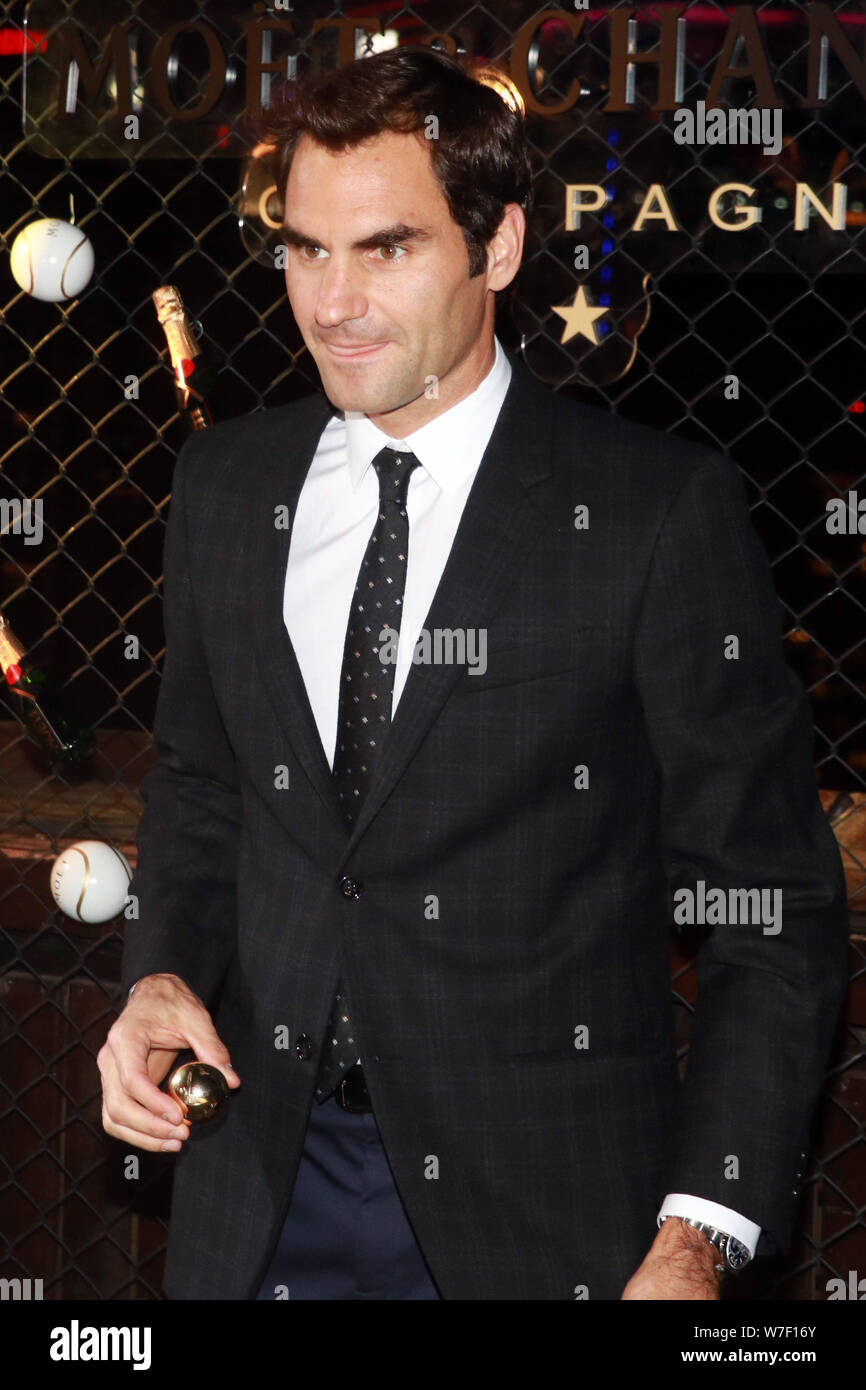 Swiss tennis player Roger Federer poses at the Moet and Chandon Party ...
