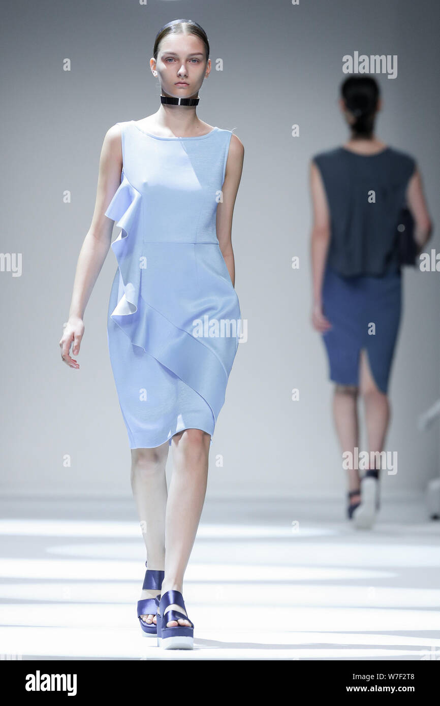 A model displays a new creation at the fashion show of AUSTIN.W. x ...