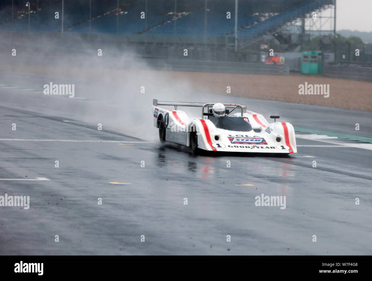 Georg Hallau, driving his 1972, Lola T310 down the International Pits ...