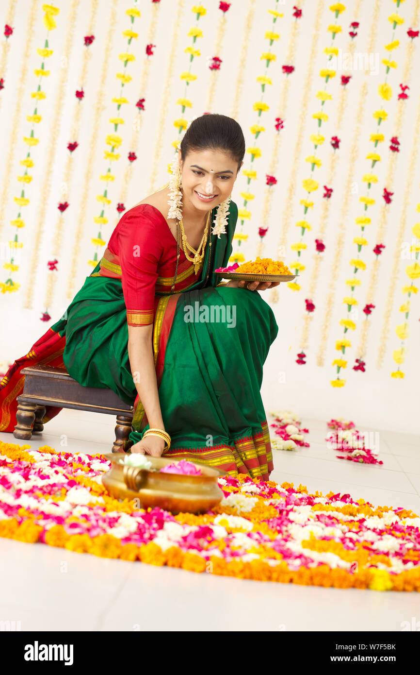 South Indian woman making rangoli Stock Photo - Alamy