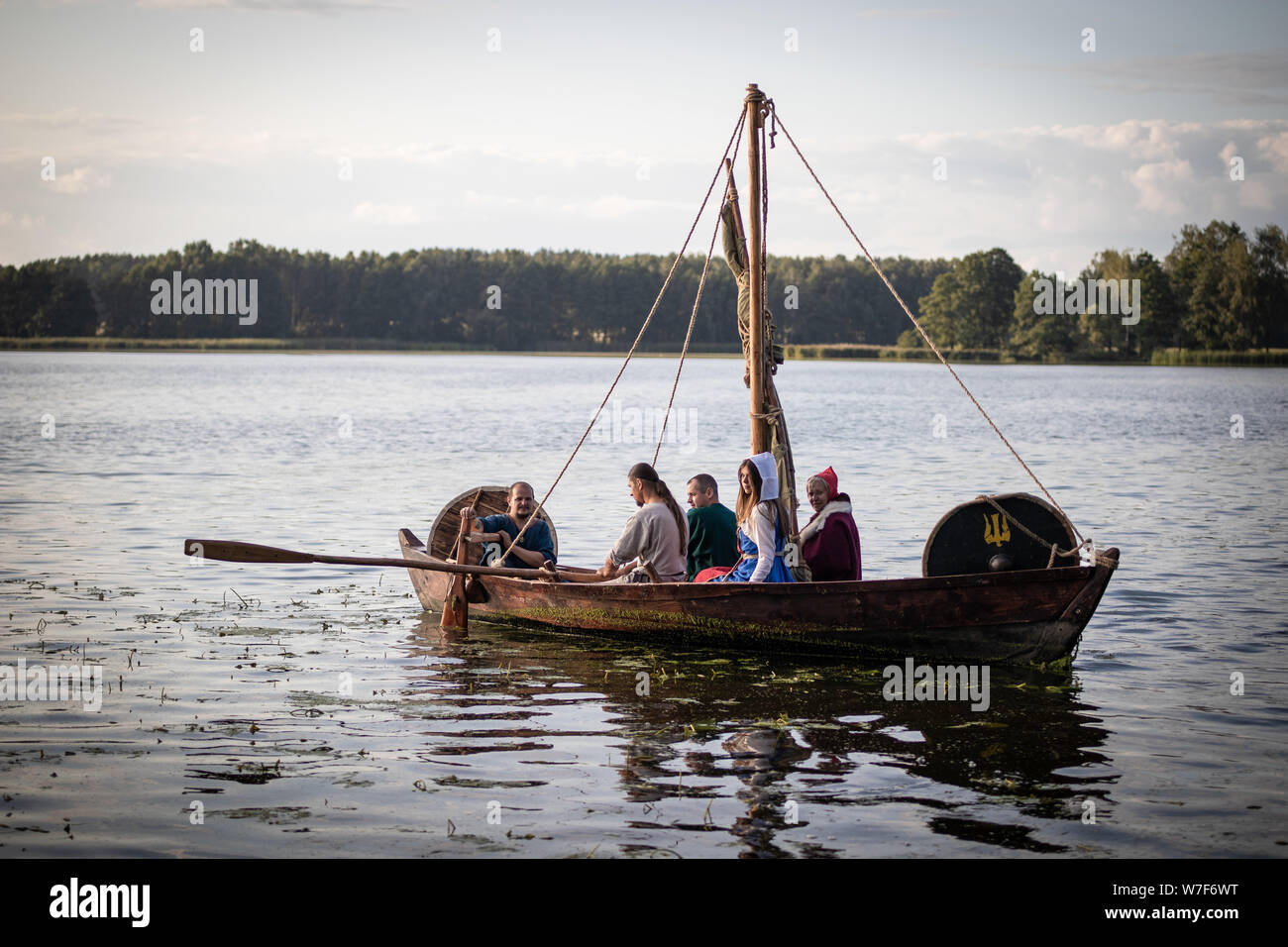 Hike on a sailing and rowing boat on the lake. Lovers of historical ...