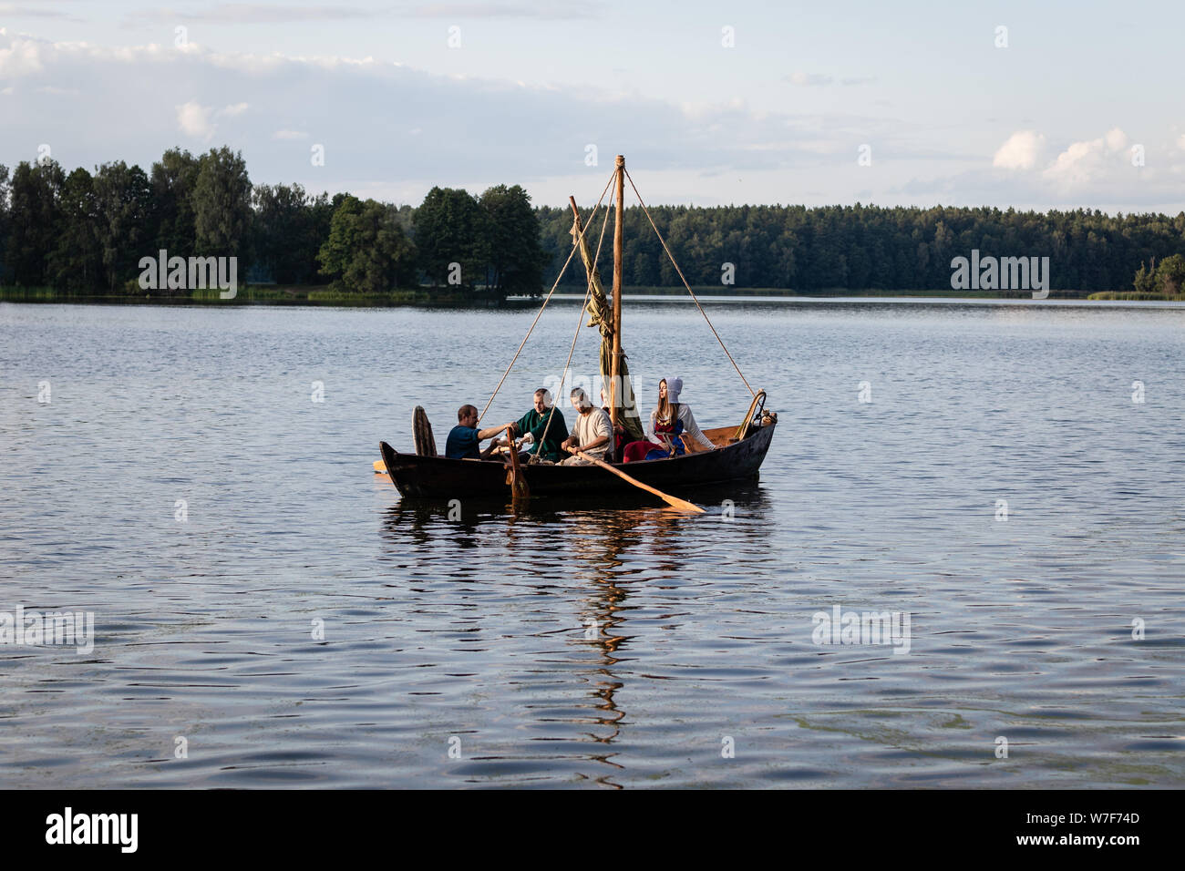 Hike on a sailing and rowing boat on the lake. Lovers of historical ...