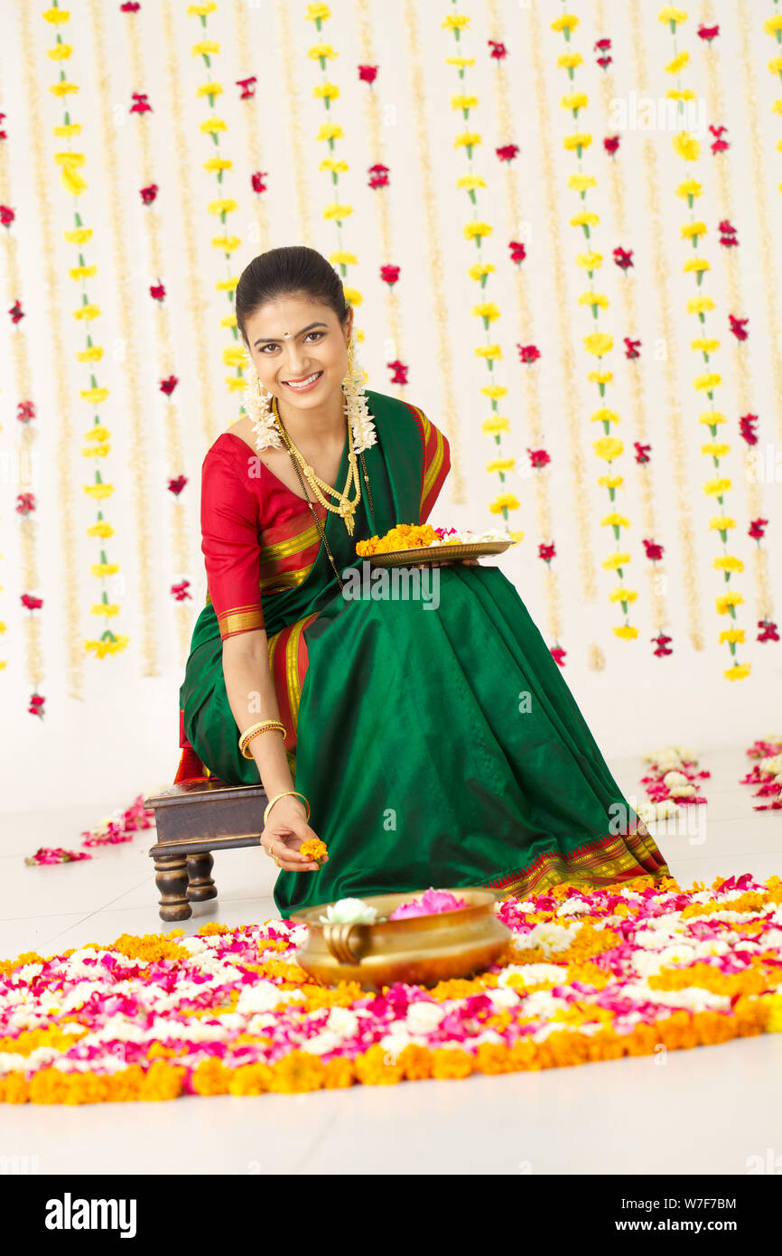 South Indian woman making rangoli Stock Photo - Alamy