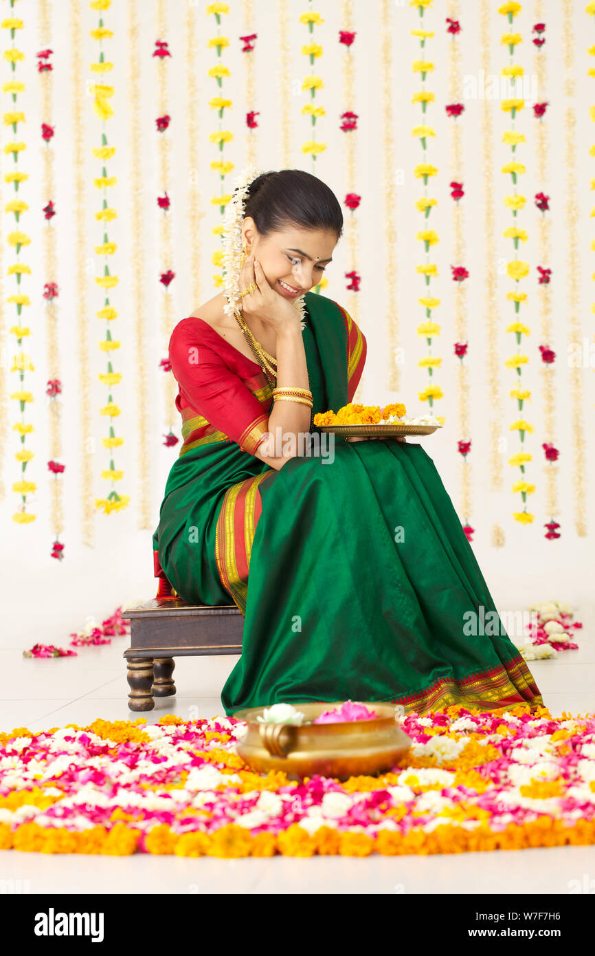 South Indian woman making rangoli Stock Photo - Alamy