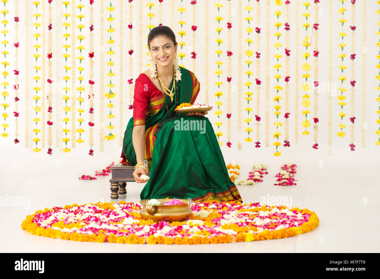 South Indian woman making rangoli Stock Photo - Alamy