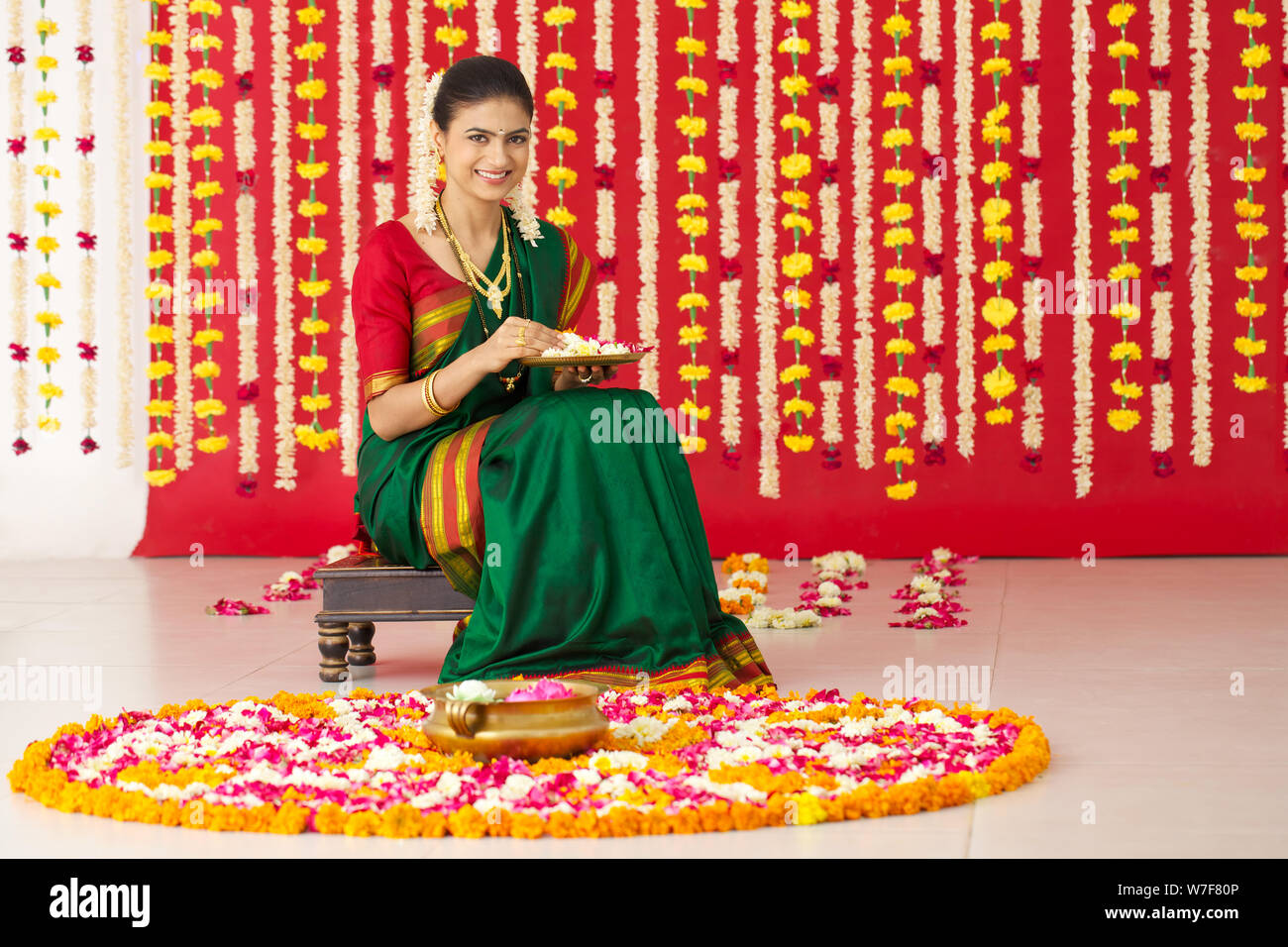 South Indian woman making rangoli Stock Photo - Alamy