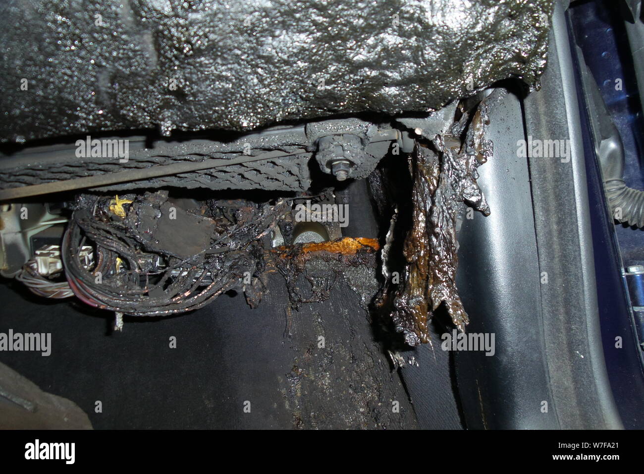 arson auto. fire inside the car. burned wiring. fused wires sticking ...