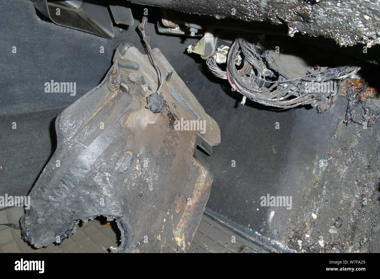 arson auto. fire inside the car. burned wiring. fused wires sticking ...