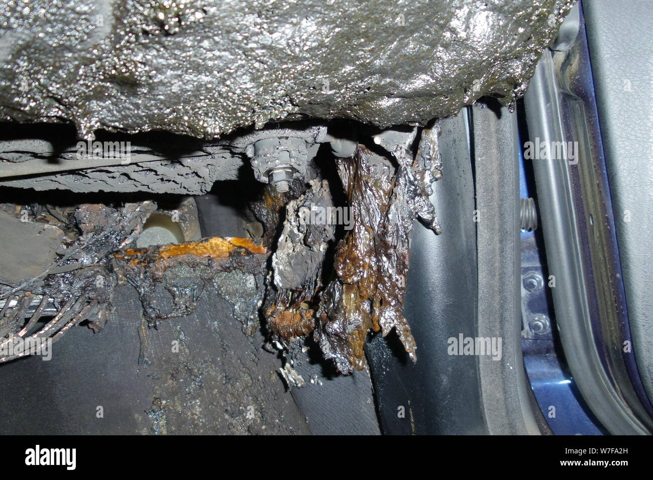 arson auto. fire inside the car. burned wiring. fused wires sticking ...