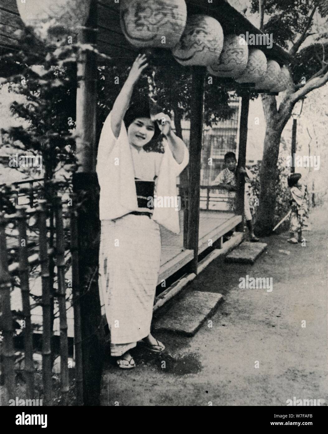 'Sweet natured smile of tea-house maid, called nesan - elder sister ...