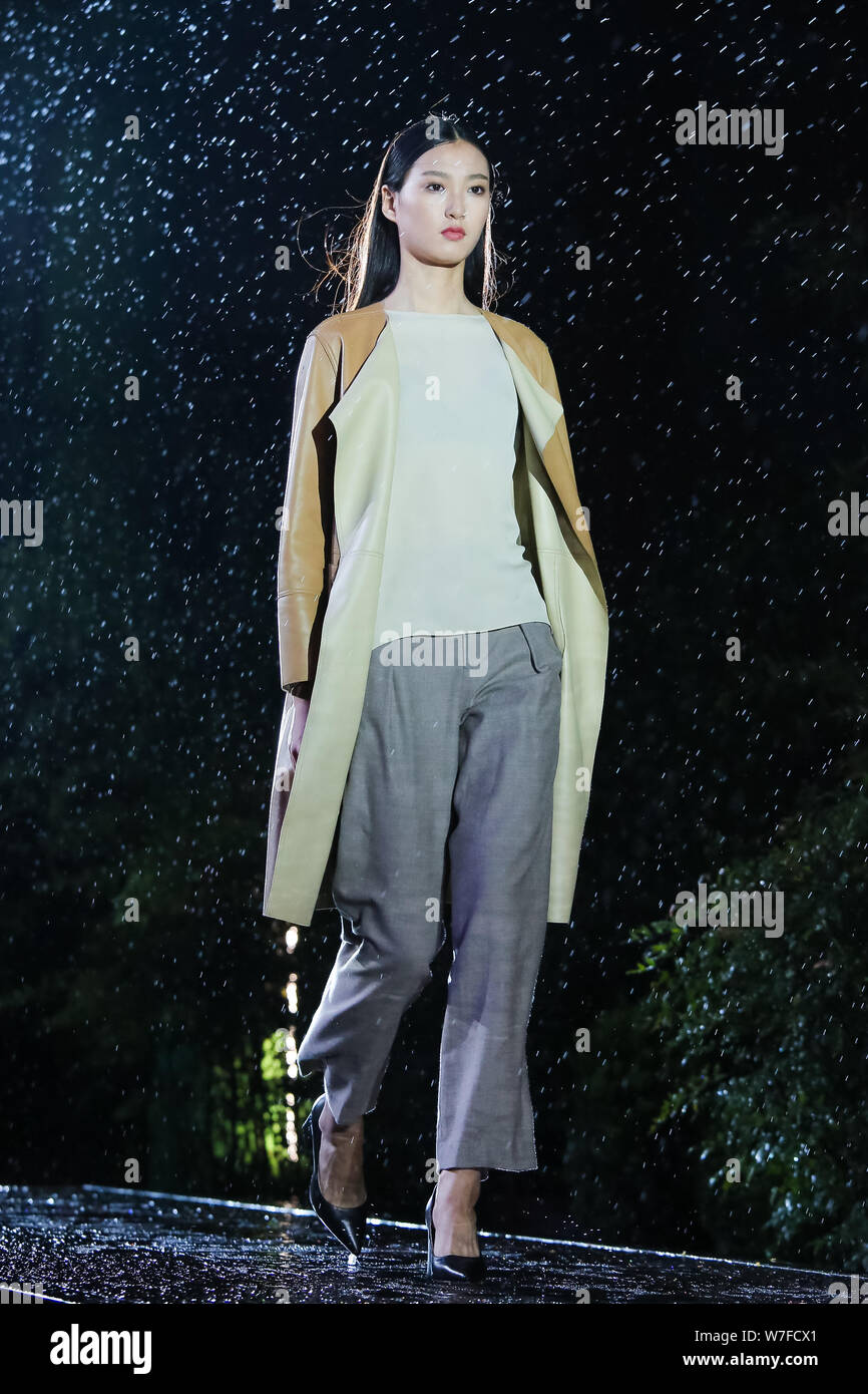 A model displays a new creation at the fashion show of Me & City during ...