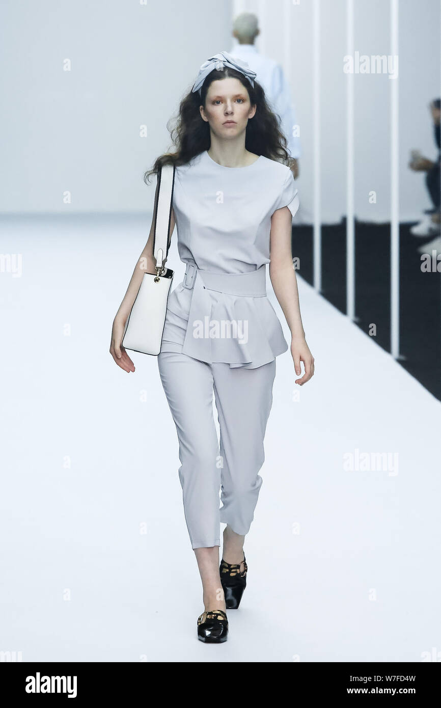 A model displays a new creation at the fashion show of Y-Vision during the Shanghai Fashion Week ...