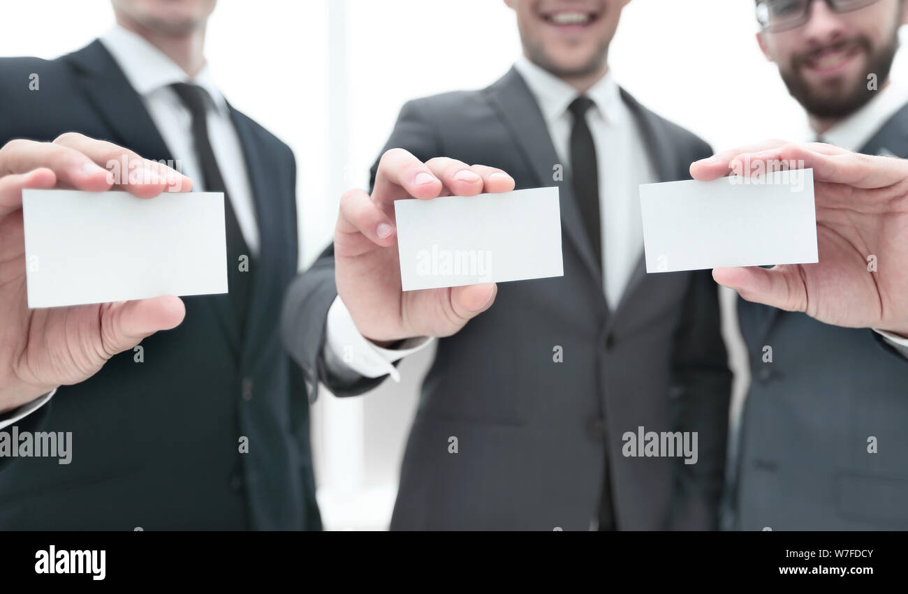 three business partners showing their business card form Stock Photo ...